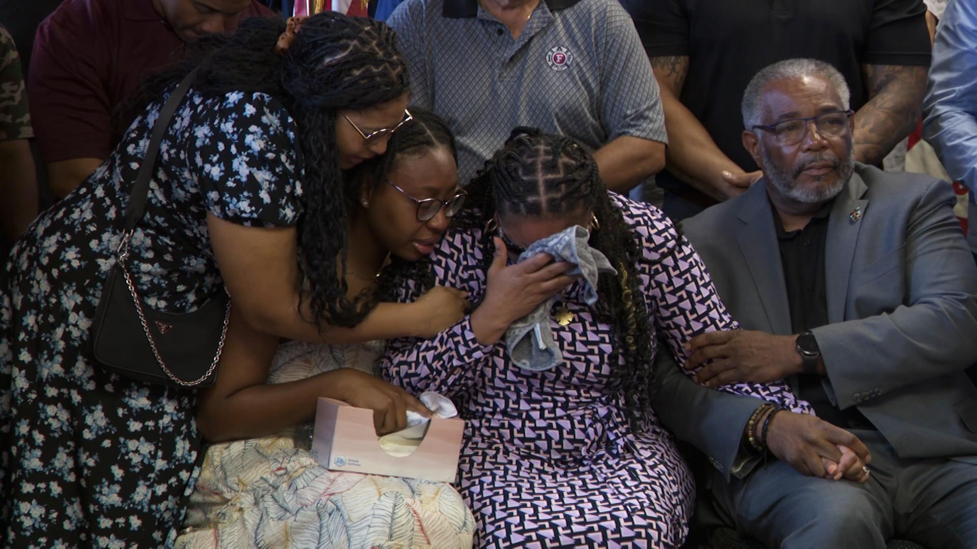 Black People Crying At A Funeral