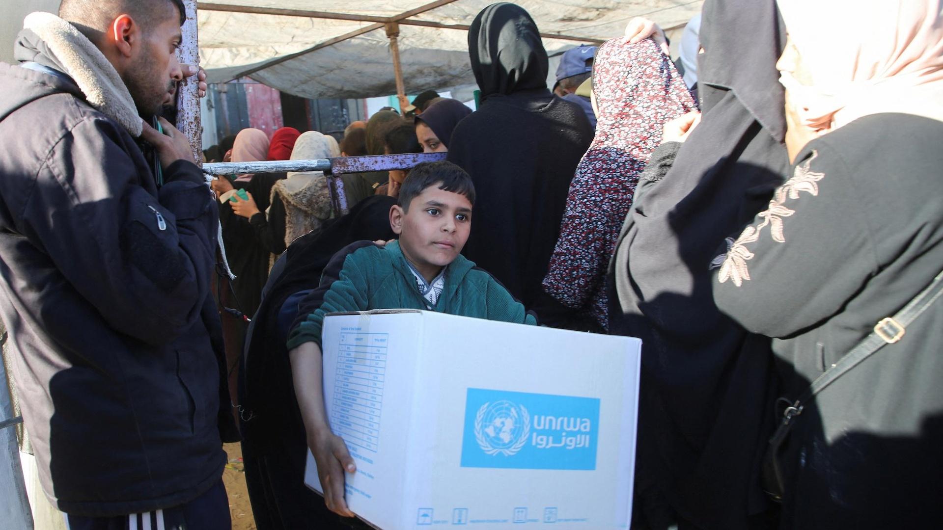 UNRWA vows to keep providing aid to Gaza despite Israeli ban | PBS News ...